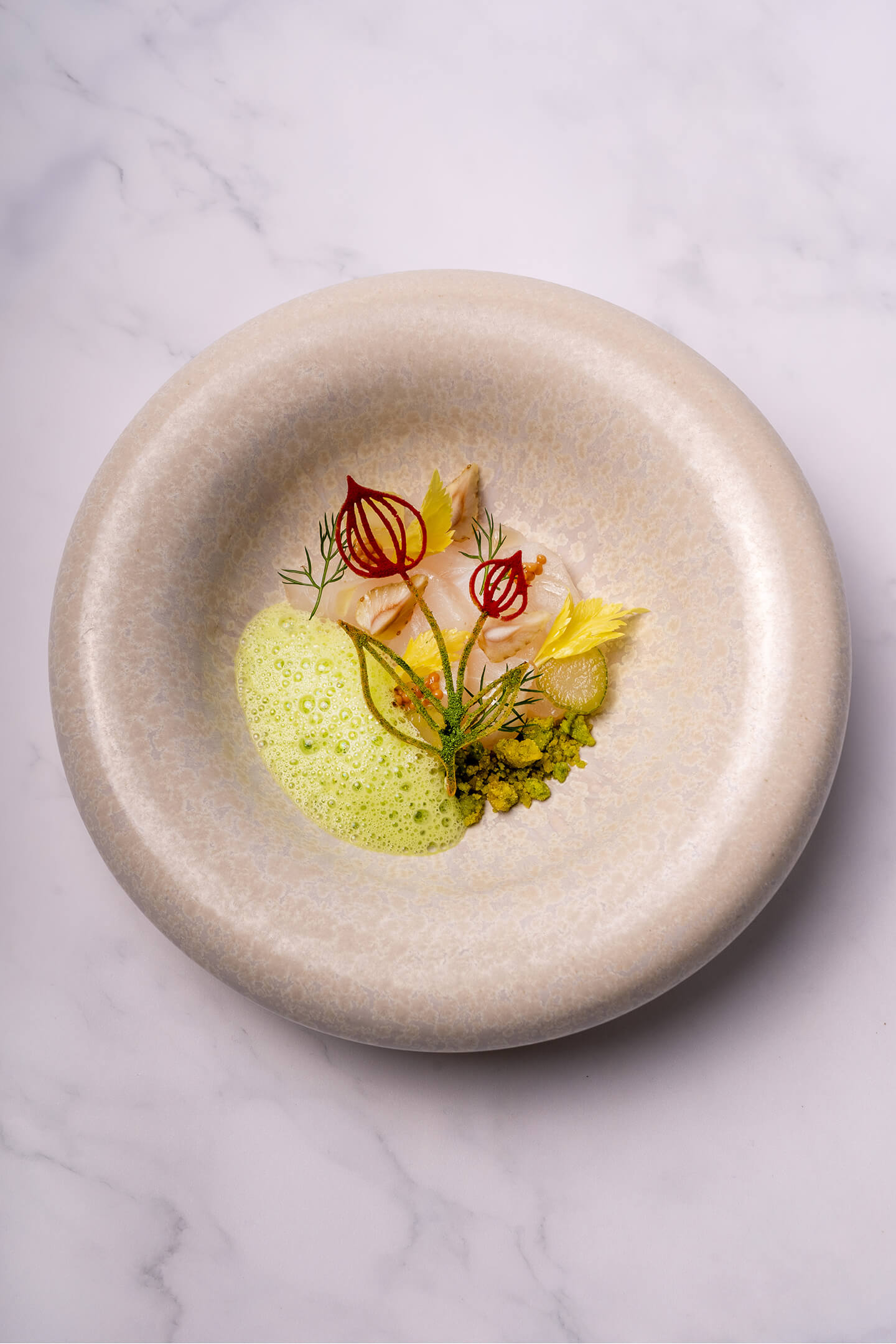 Skrei crudo with ramson and green strawberry