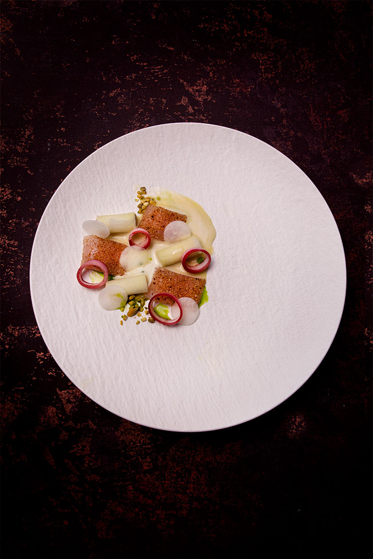 Spiced trout fillet with labneh, kohlrabi cannelloni, and pistachio